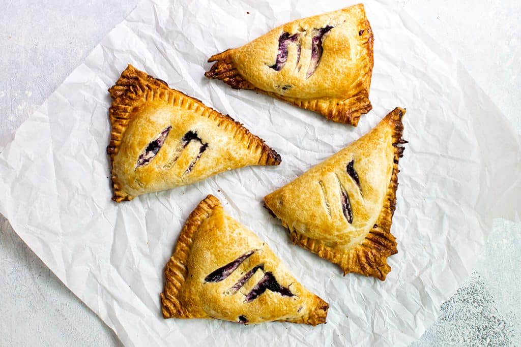 Freezer-Friendly Blueberry Hand Pies - Girl Gone Gourmet